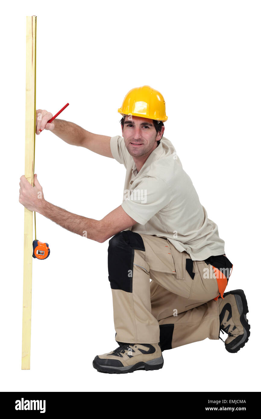 Carpenter taking measurements Stock Photo - Alamy