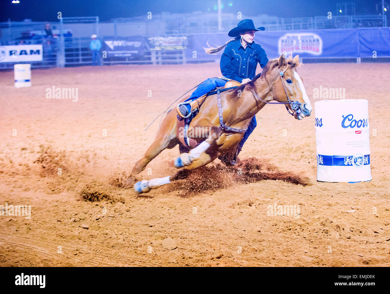 Cowgirl Participating in a Barrel racing competition in the Clark ...