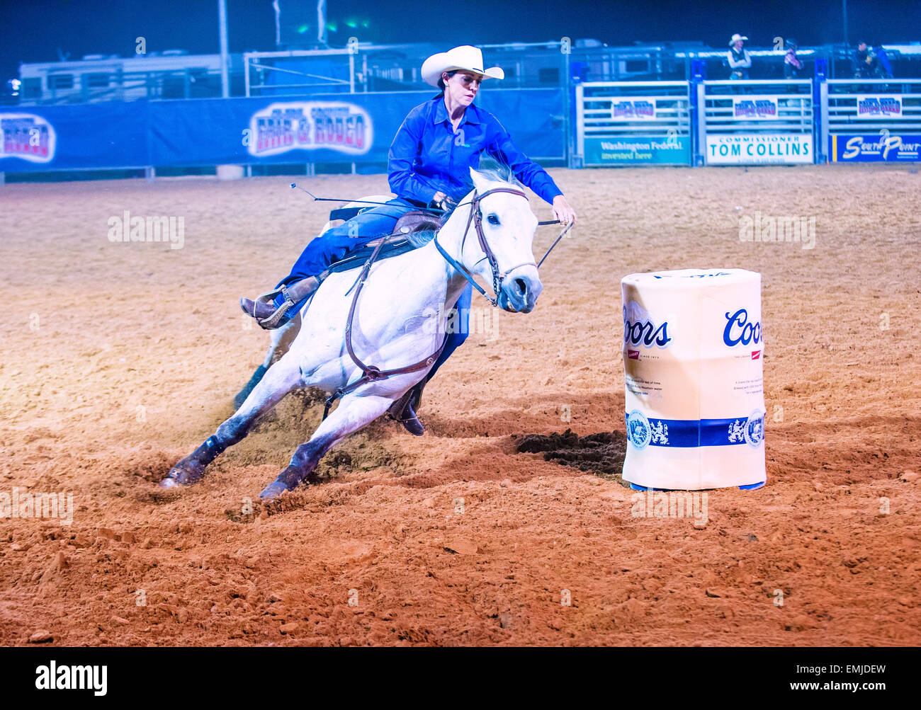 Cowgirl Participating in a Barrel racing competition in the Clark ...