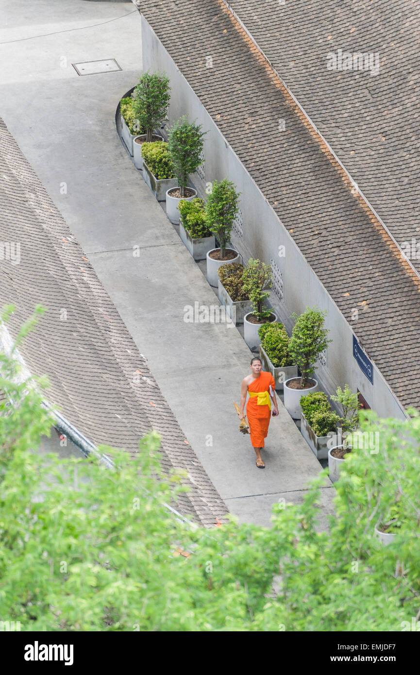 A young Monk walking through the temple. Bangkok Thailand Stock Photo ...