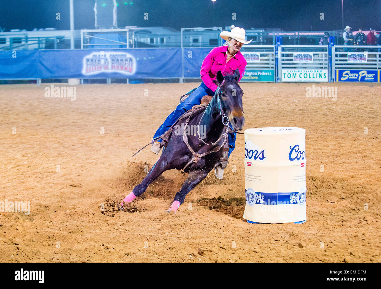 Cowgirl Participating in a Barrel racing competition in the Clark ...