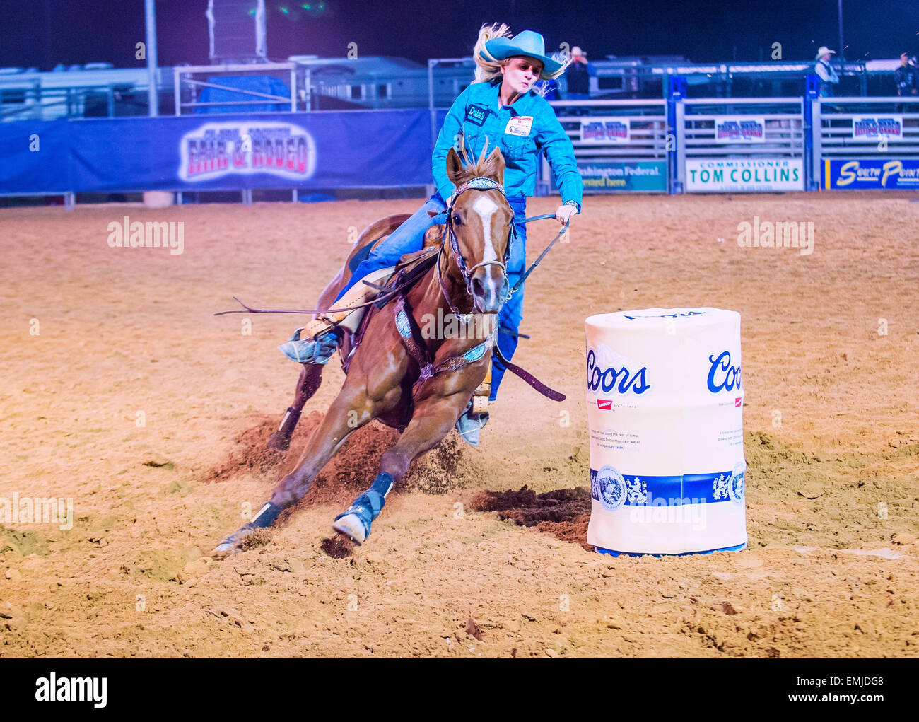 Cowgirl Participating in a Barrel racing competition in the Clark ...