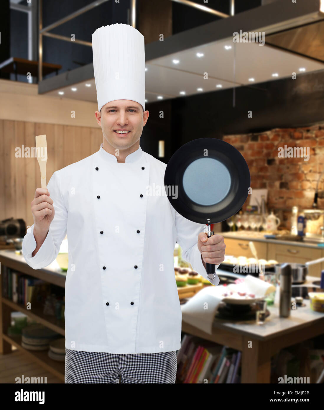 happy male chef holding frying pan and spatula Stock Photo - Alamy
