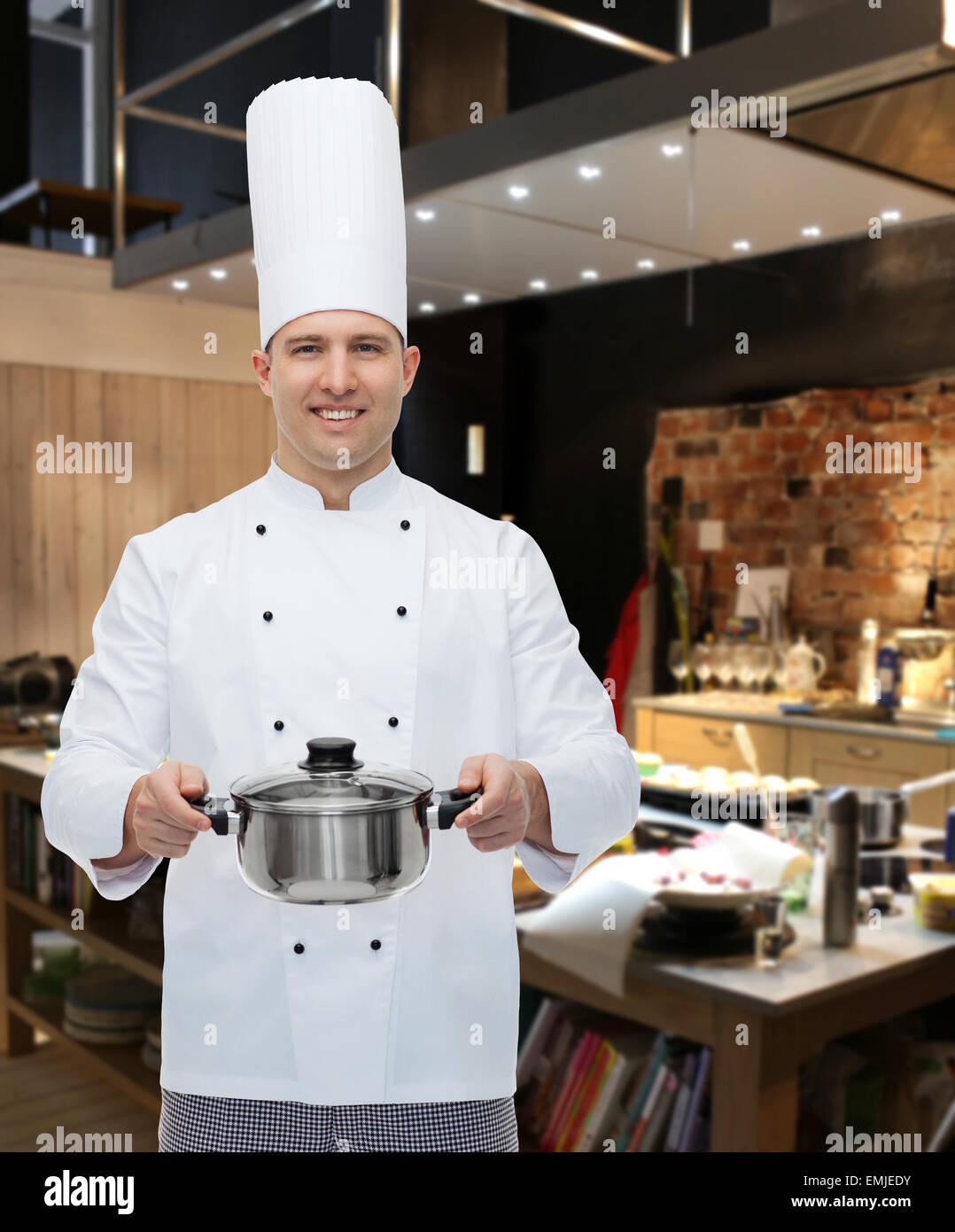happy male chef cook holding pot Stock Photo - Alamy