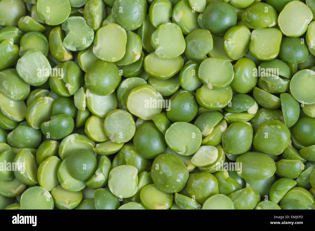Uncooked split pea green textured background Stock Photo - Alamy