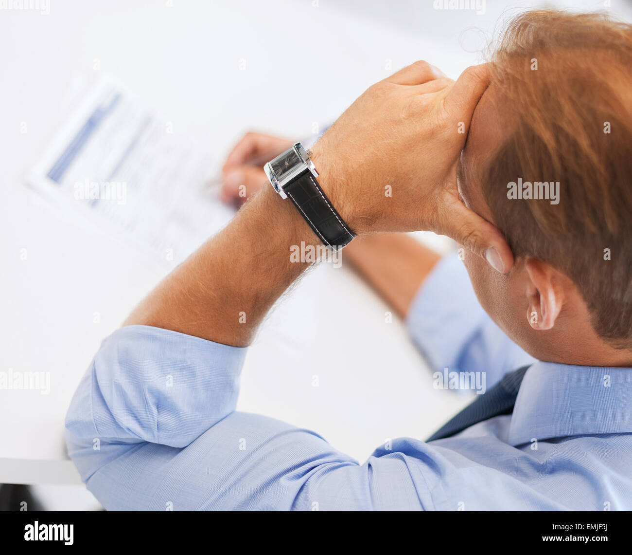 stressed man filling tax form Stock Photo - Alamy