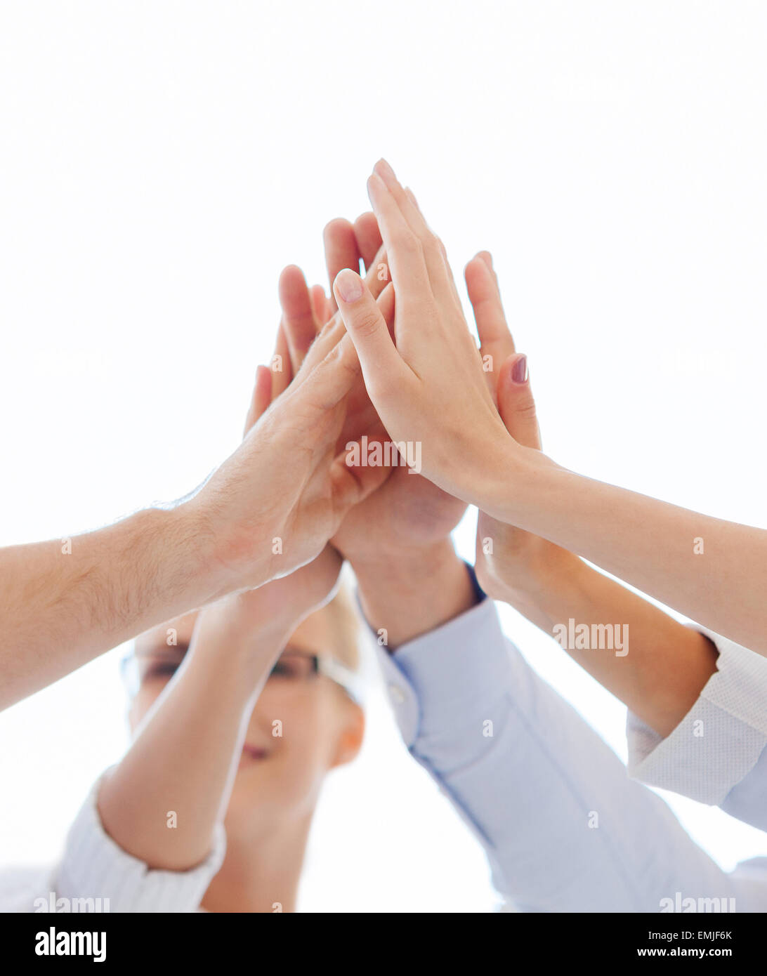 happy business team giving high five in office Stock Photo - Alamy