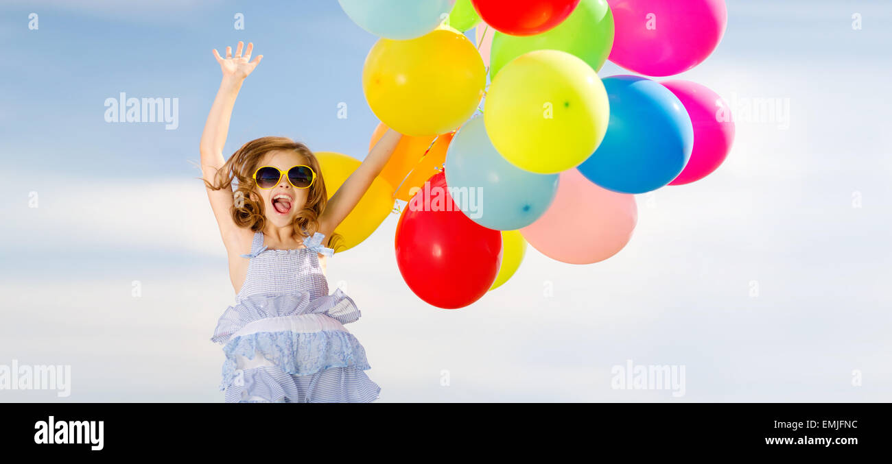 happy jumping girl with colorful balloons Stock Photo - Alamy