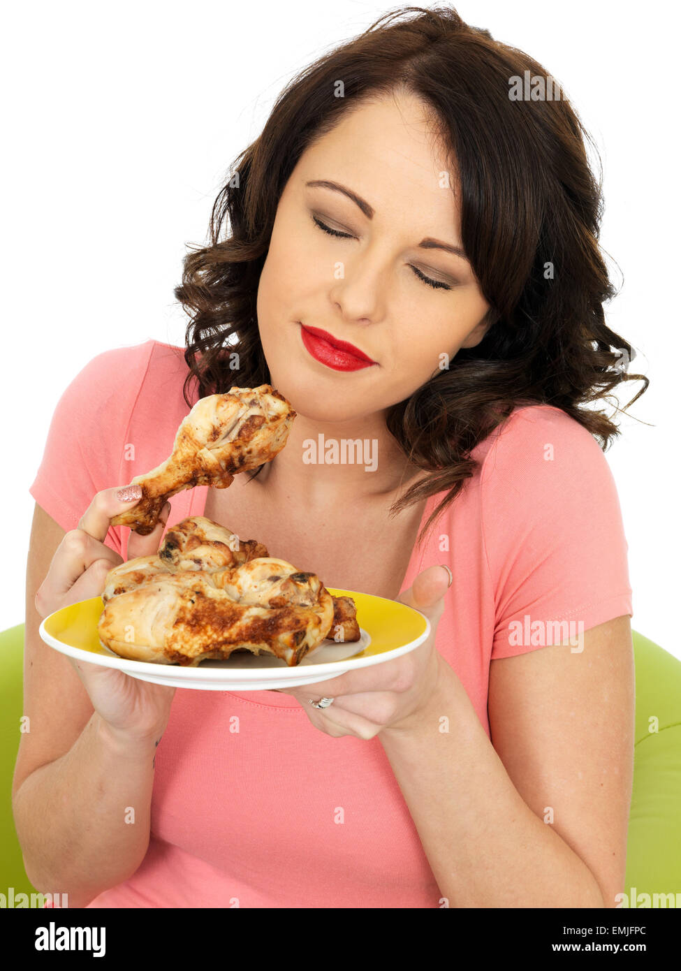 Young Happy Confident Woman Eating A Cold Cooked Chicken Leg Isolated ...