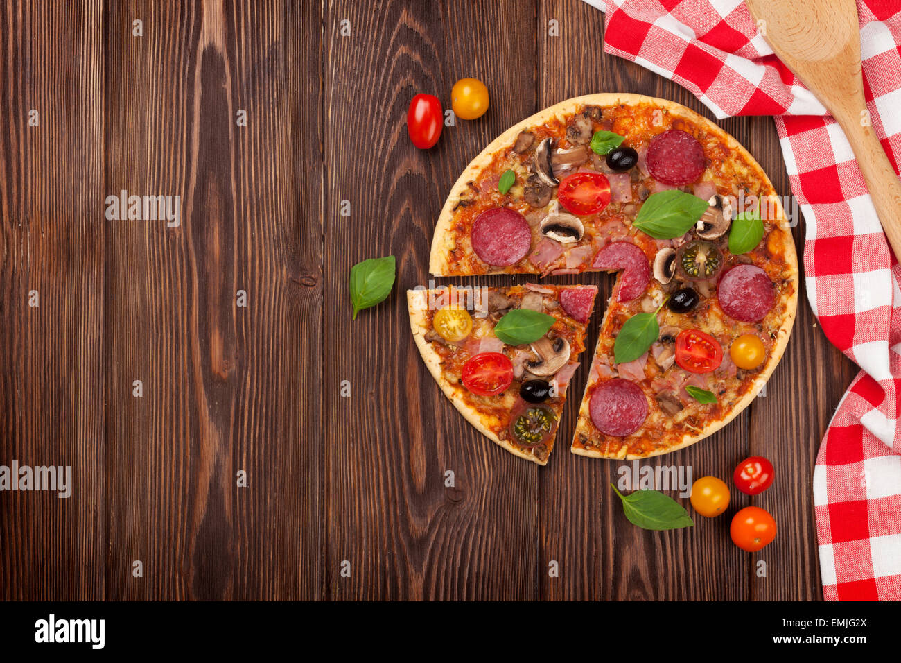 Italian pizza with pepperoni on wooden table. Top view with copy space ...