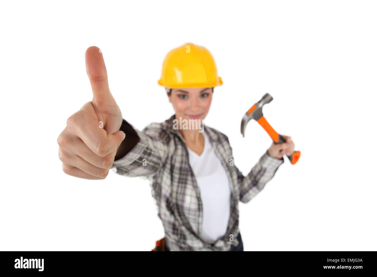 Woman with hammer giving thumbs up Stock Photo - Alamy