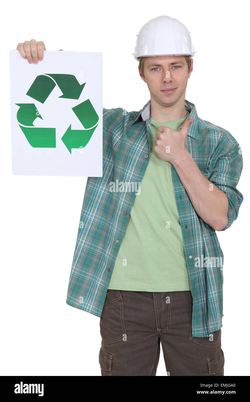 Workman holding sign Stock Photo - Alamy