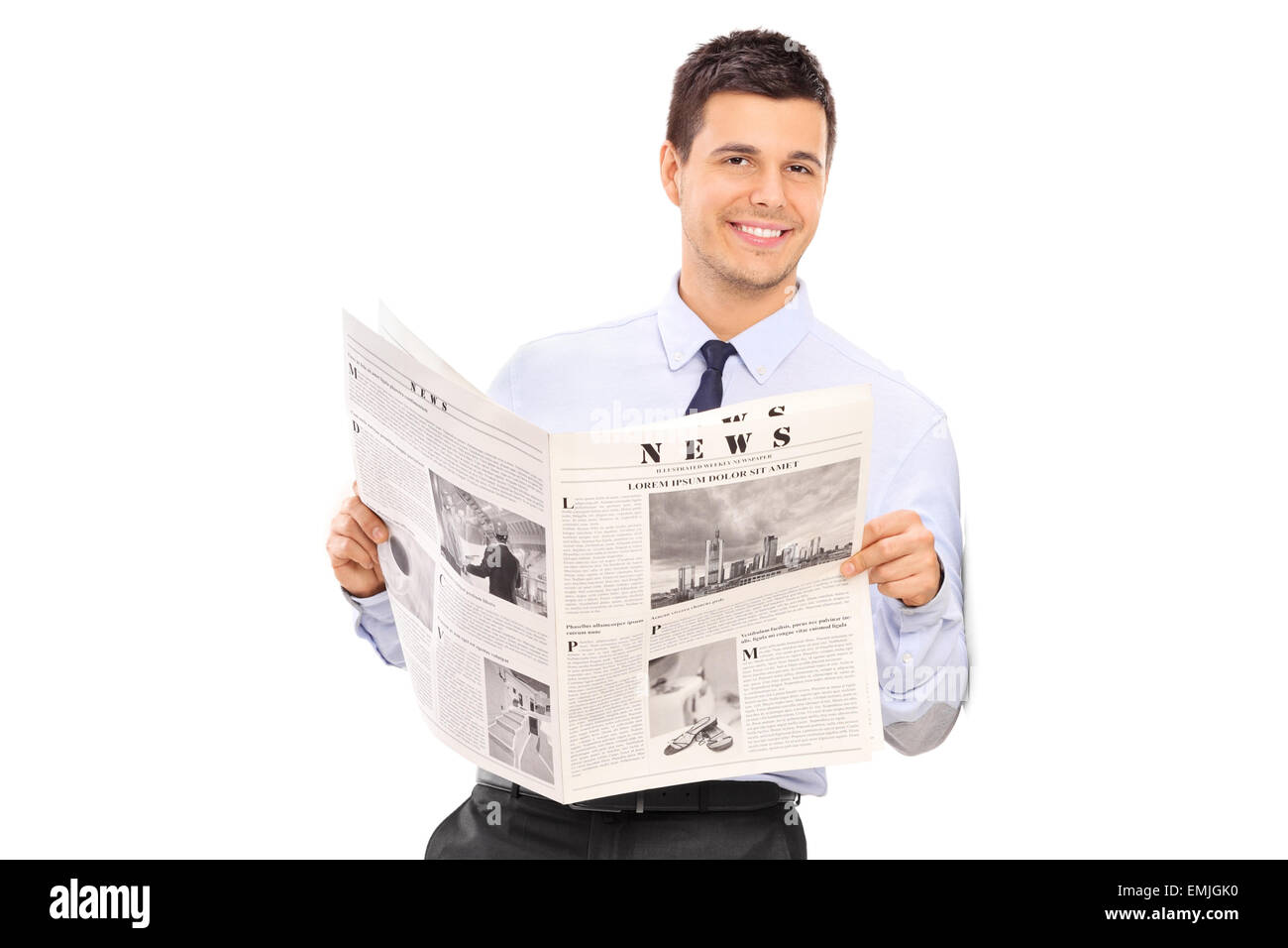 Handsome man holding a newspaper and leaning against a wall isolated on ...