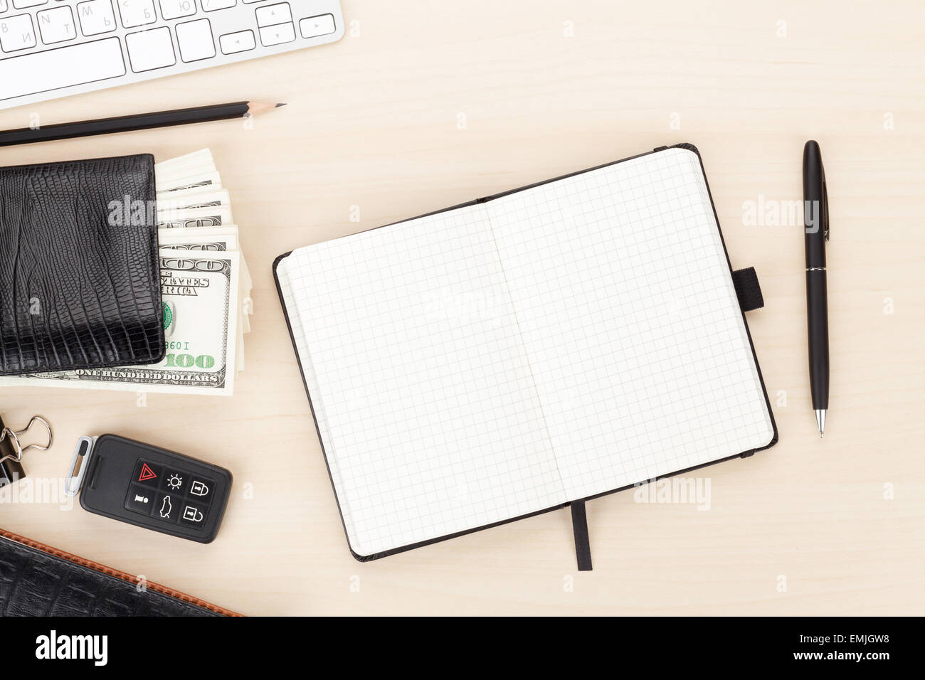 Office table with pc, supplies and money cash. View from above with ...