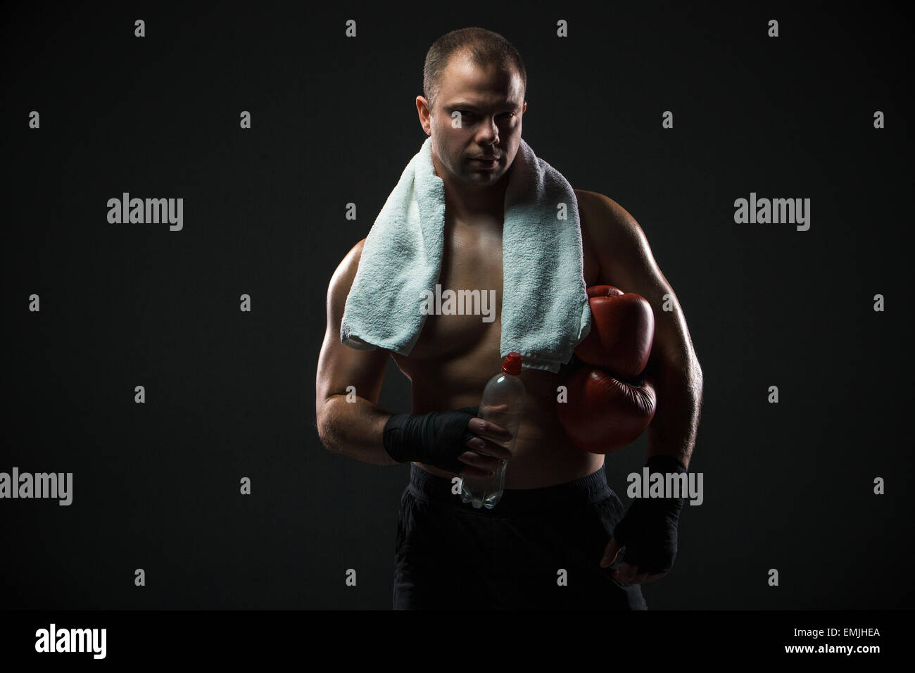 boxer resting with water and a towel after training Stock Photo - Alamy