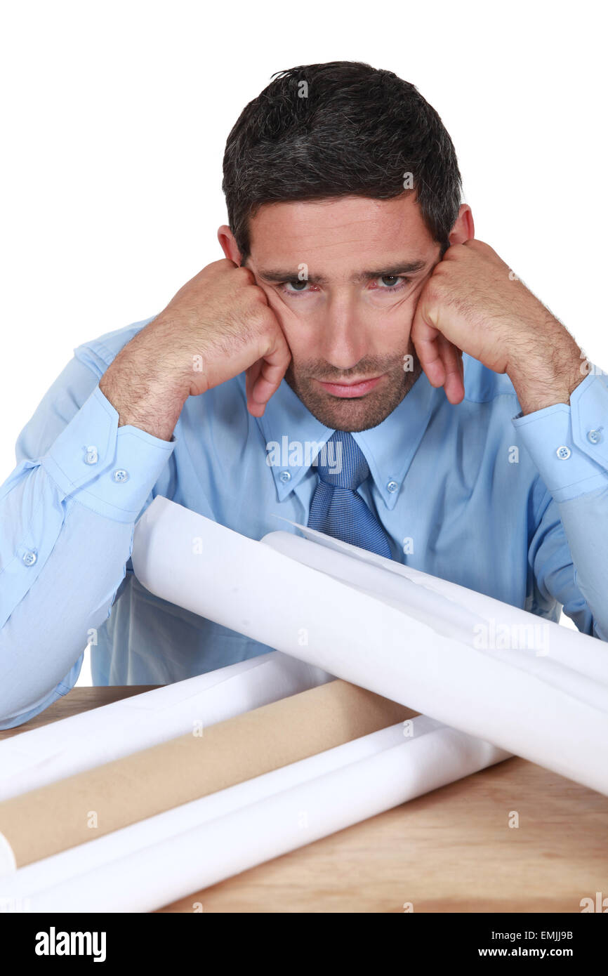 Male architect leaning over blueprints hi-res stock photography and ...