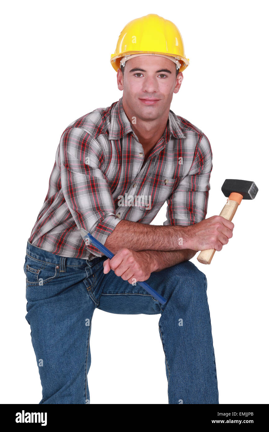 craftsman holding a huge hammer Stock Photo - Alamy