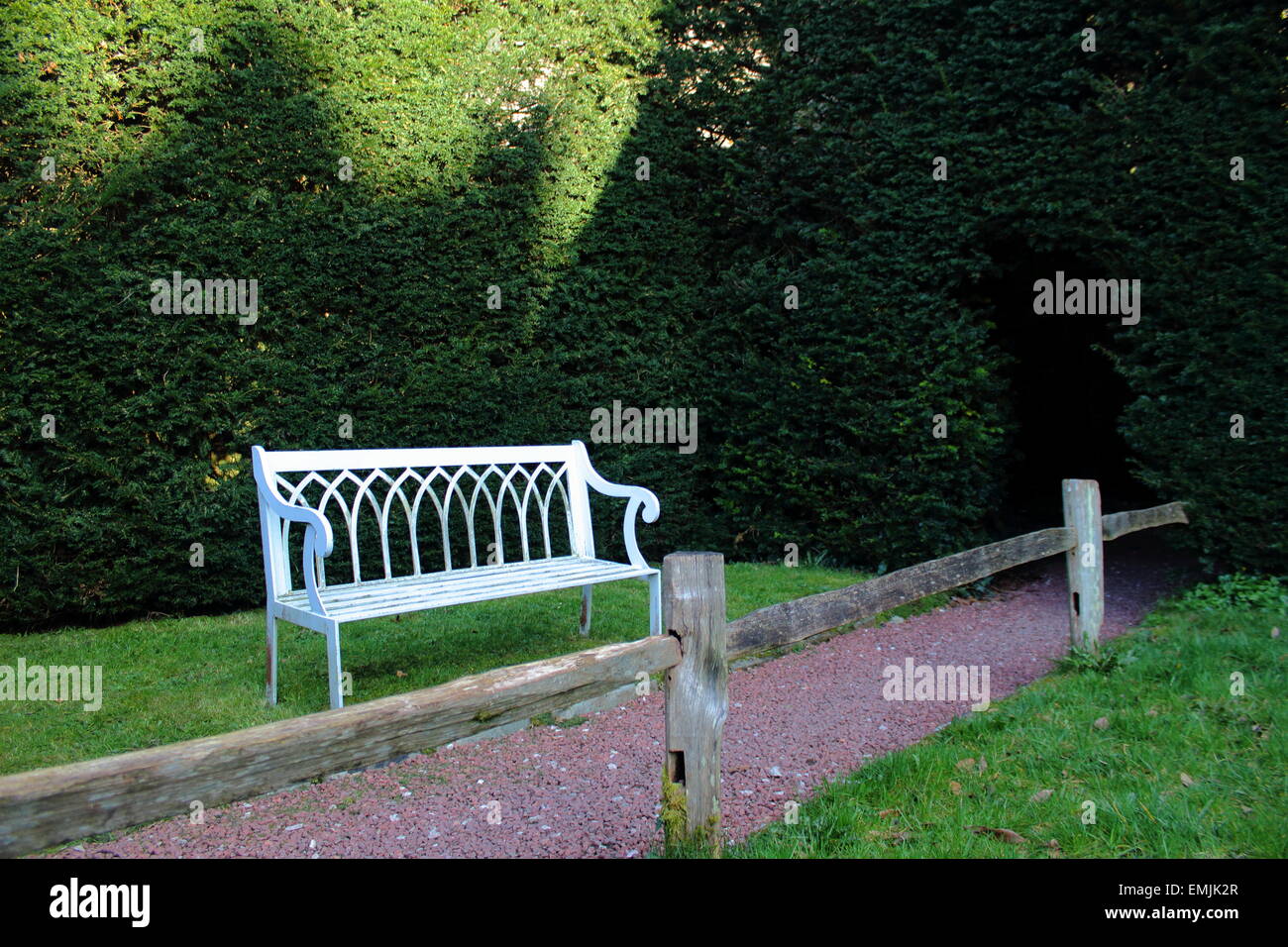 Peaceful white bench in the quiet gardens of Buckland Abbey, National ...