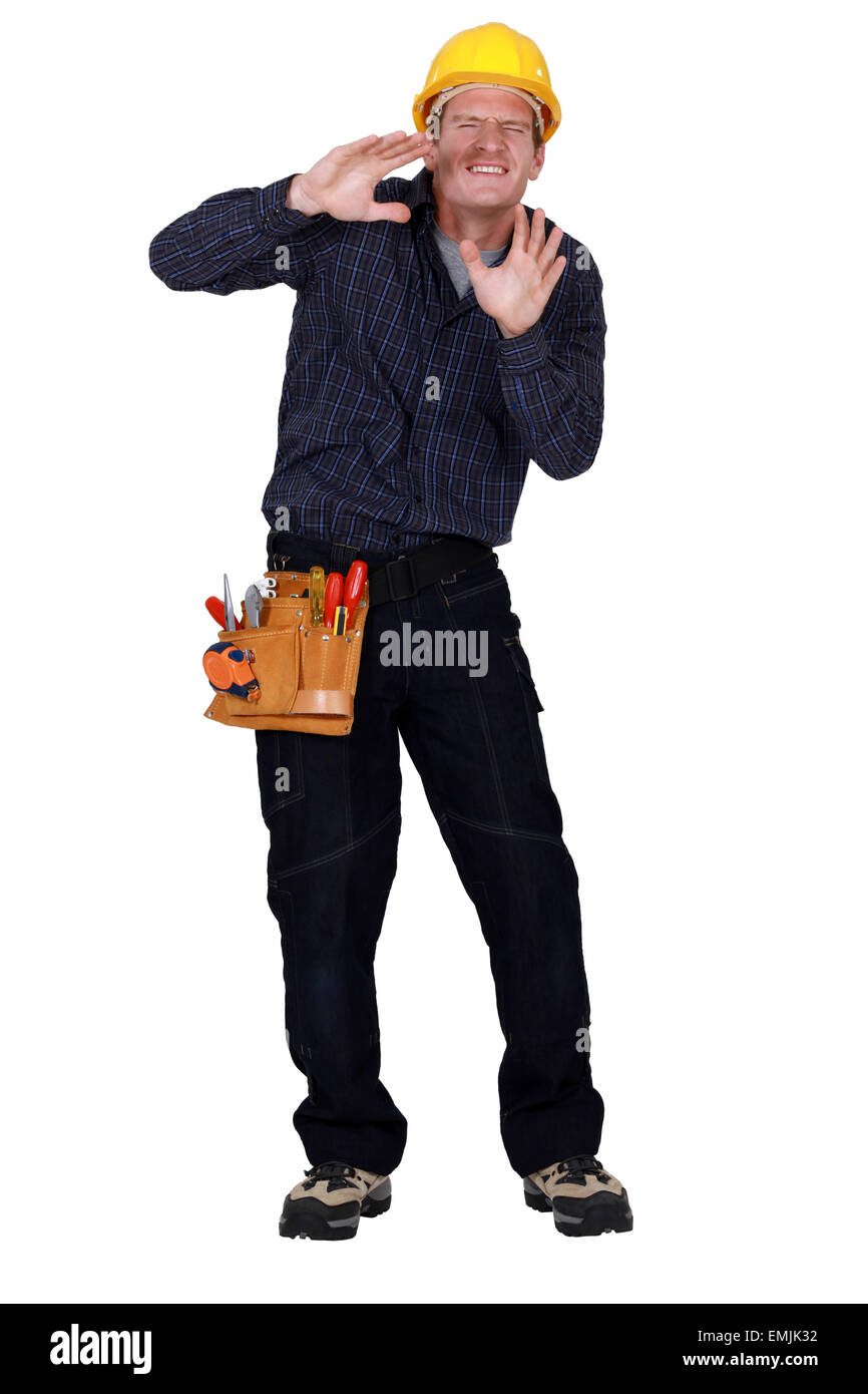 Tradesman being blinded by light Stock Photo - Alamy