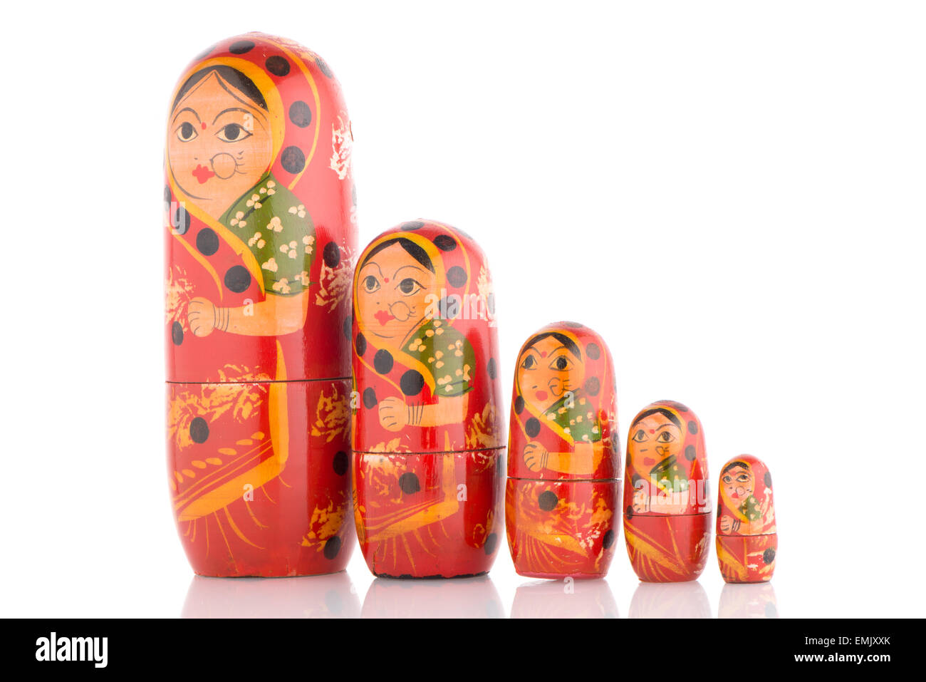 Five red Babushka on white reflective background Stock Photo - Alamy