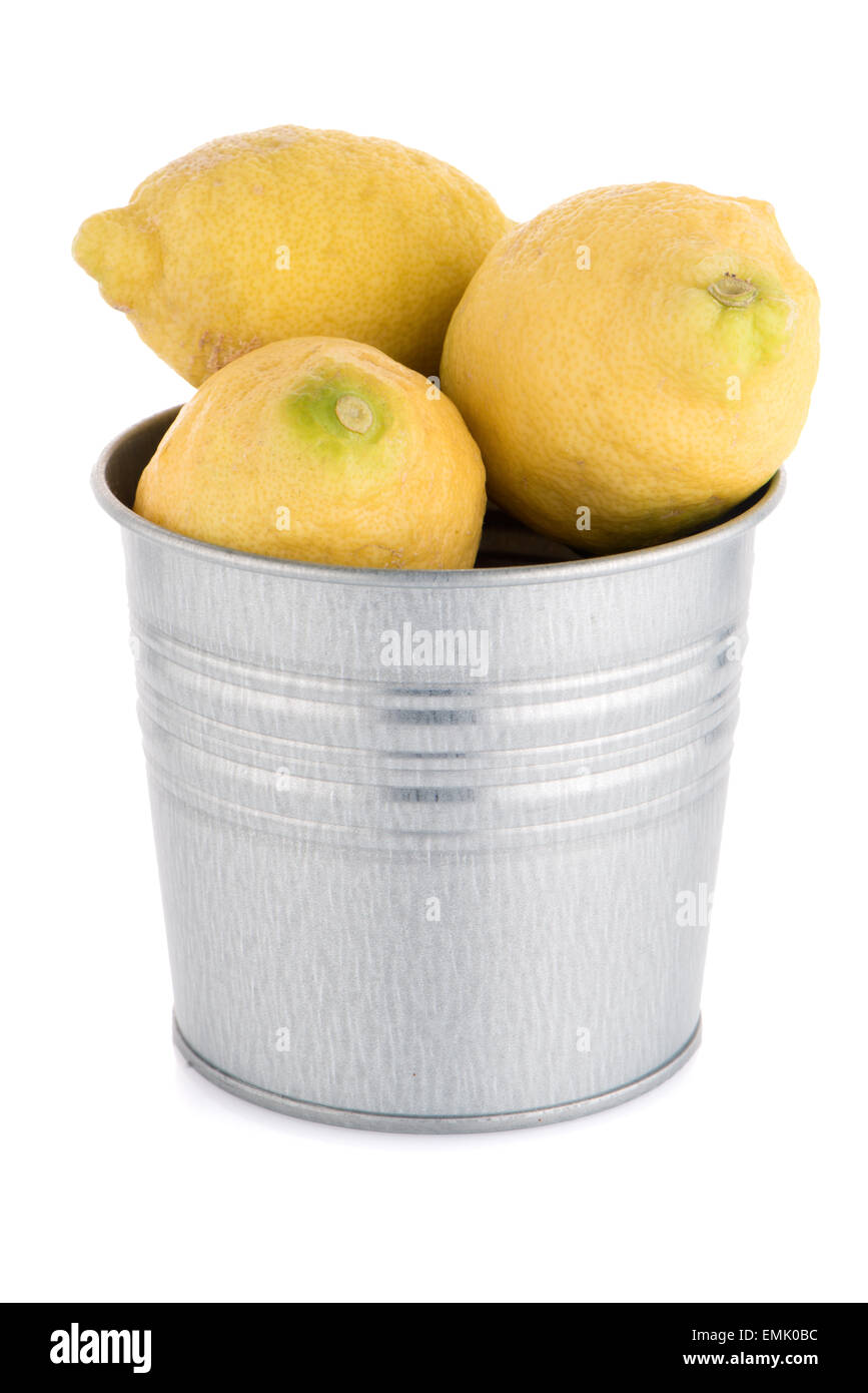 Bucket with lemons on white background Stock Photo - Alamy