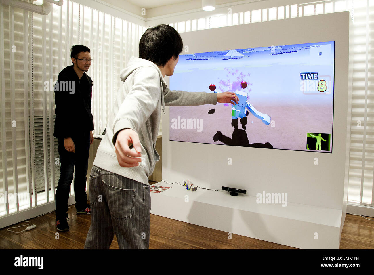 A man plays a video game moving his body at the "Play the future with ...