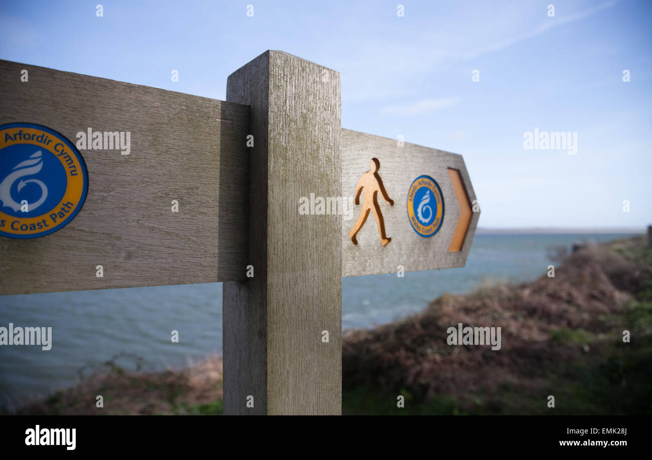 Close-up creative shot of Wales Coastal Path oak Signage and footpath ...