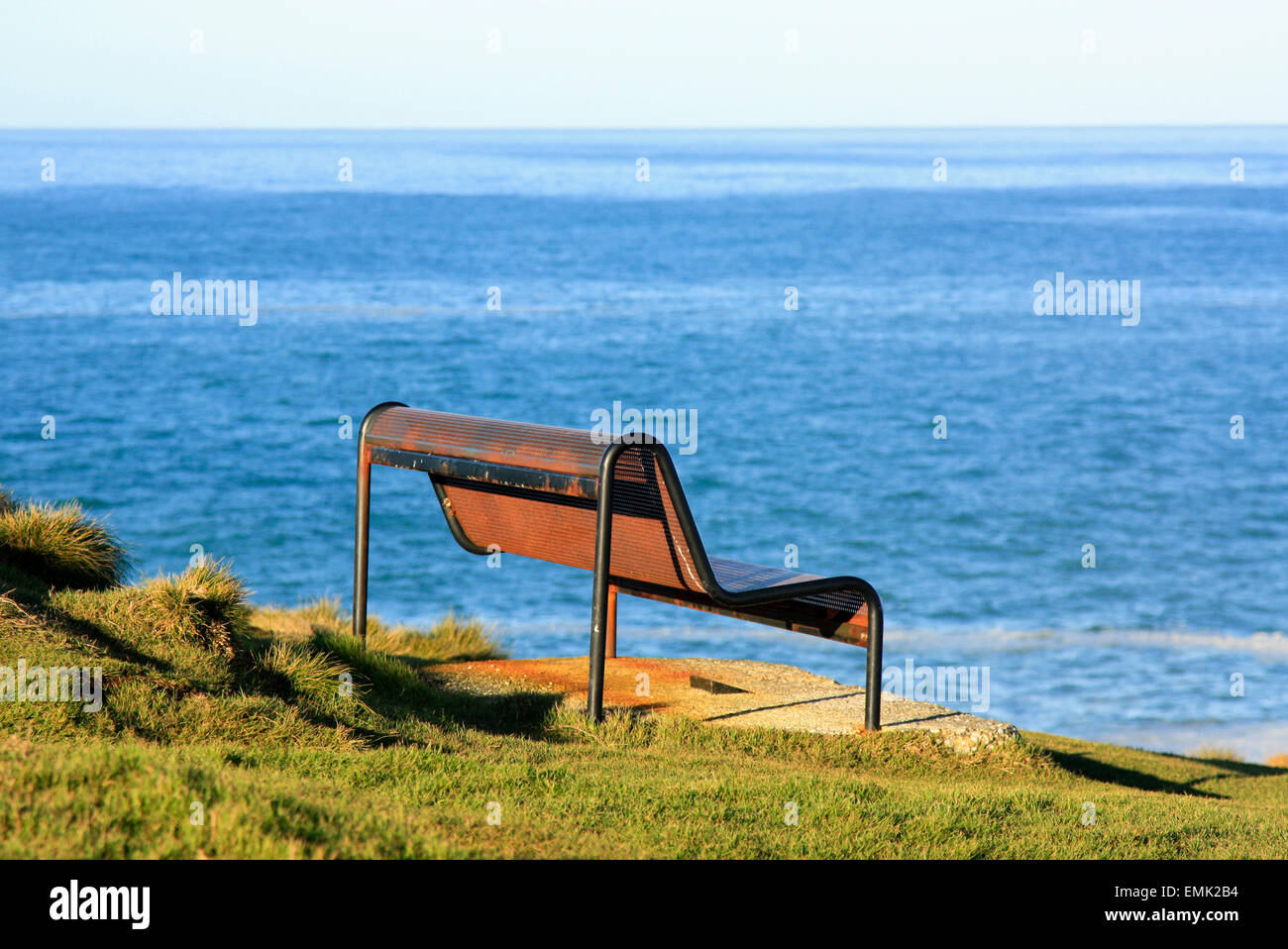 a old steel bench overlooking the ocean Stock Photo - Alamy