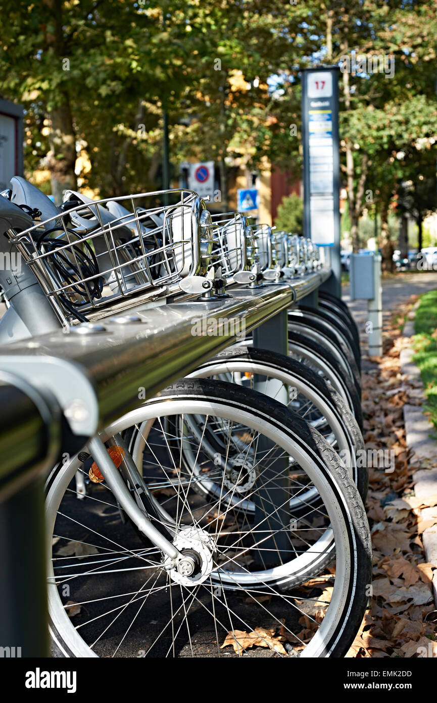 Bikes for rent on street of city Stock Photo - Alamy