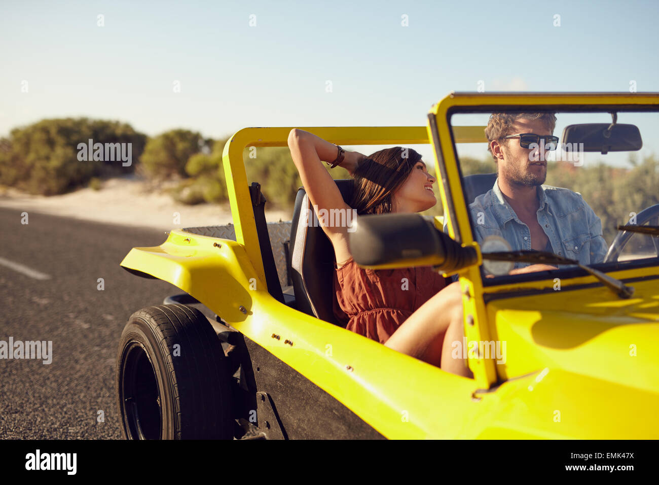 Romantic Young Couple On A Road Trip In A Car Caucasian Young Man And Woman Going On A Holiday