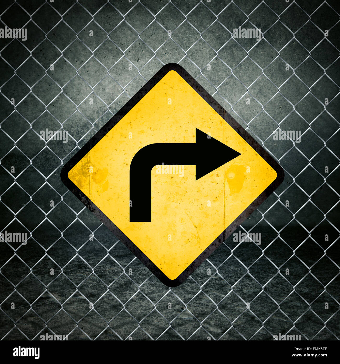 Right Direction Grunge Yellow Warning Sign on Chain link Fence of ...