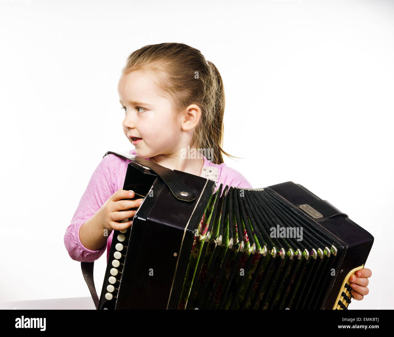 Cute little girl playing harmonica, isolated on white, music education ...