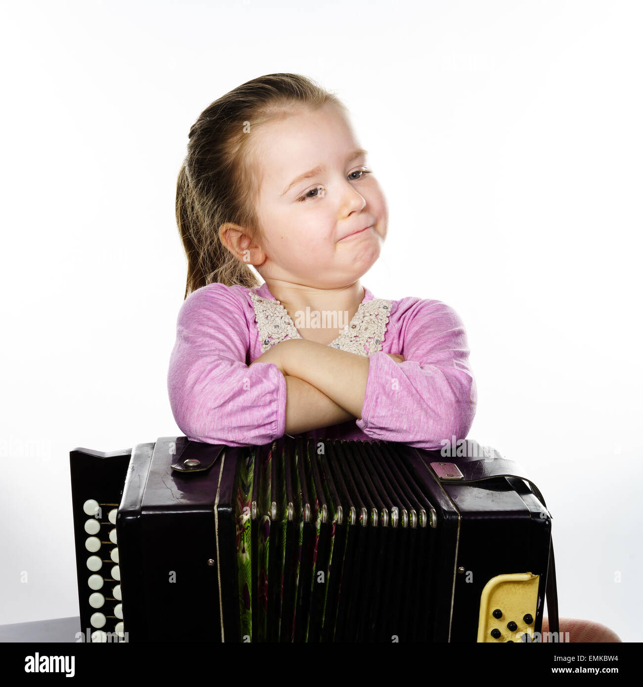 Cute little girl playing harmonica, isolated on white, music education ...