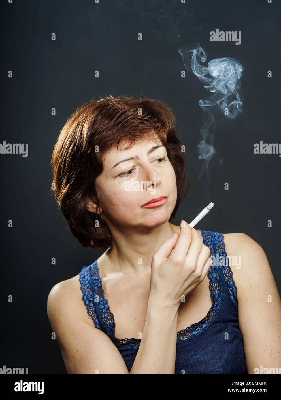 Young woman smoking cigarette, healthcare concept, isolated Stock Photo ...