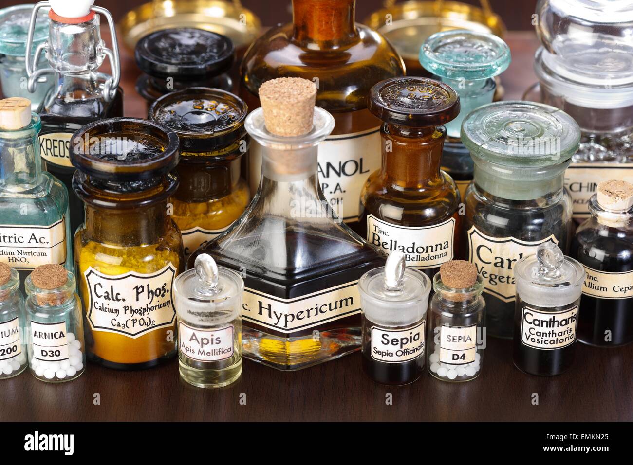 Various pharmacy bottles of homeopathic medicine on dark background ...
