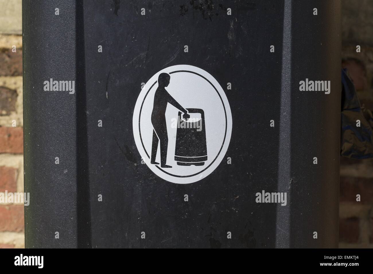 A bin it sign on a public rubbish bin Stock Photo - Alamy