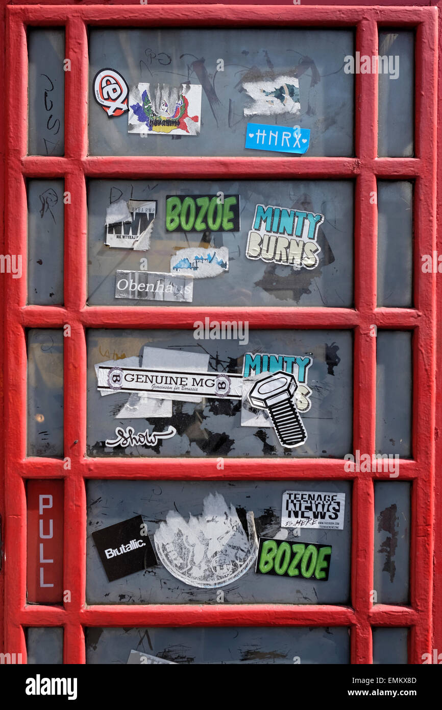 A British telephone box covered in stickers in Strand, London, England ...
