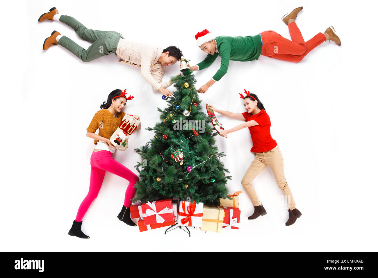Adults decorating tree hi-res stock photography and images - Alamy