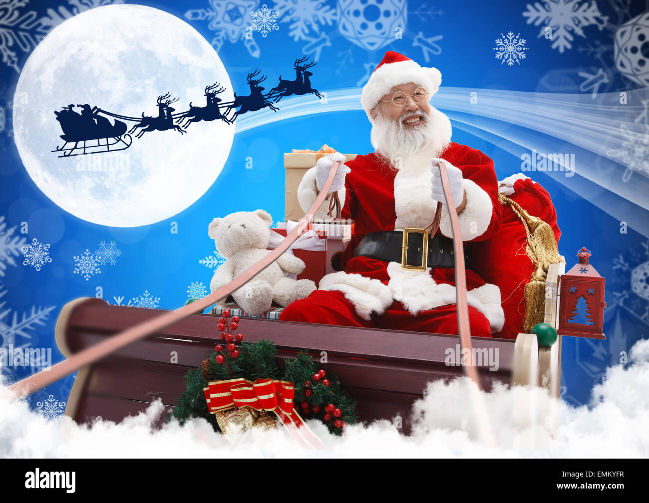 Santa Claus rides the sled to send a gift Stock Photo - Alamy