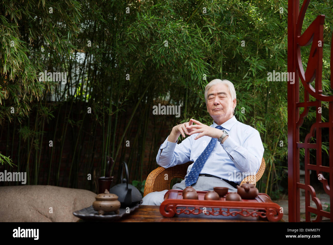 An old man sat in the yard with closed eyes Stock Photo - Alamy