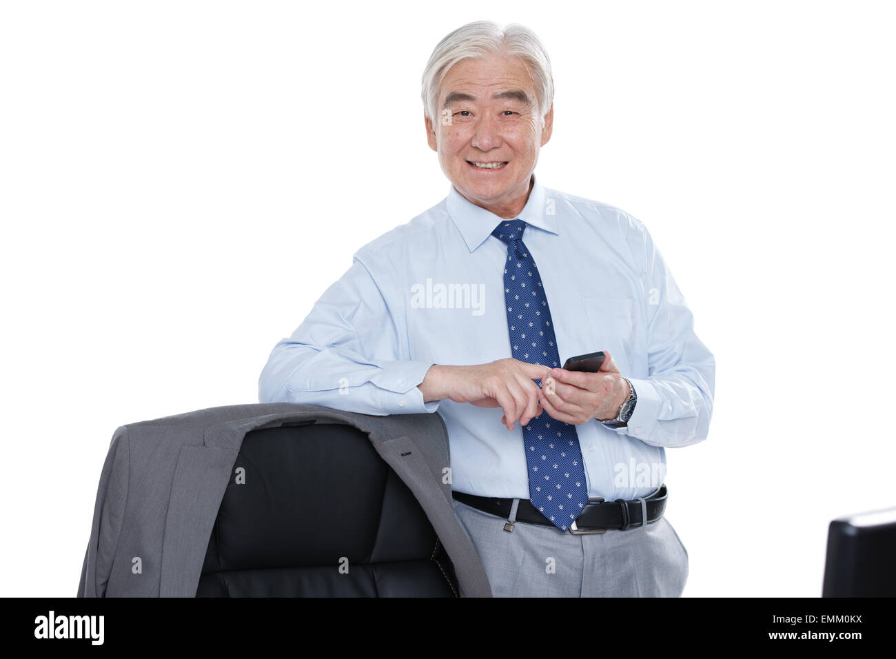 An old man holding a mobile phone in the Office Stock Photo - Alamy