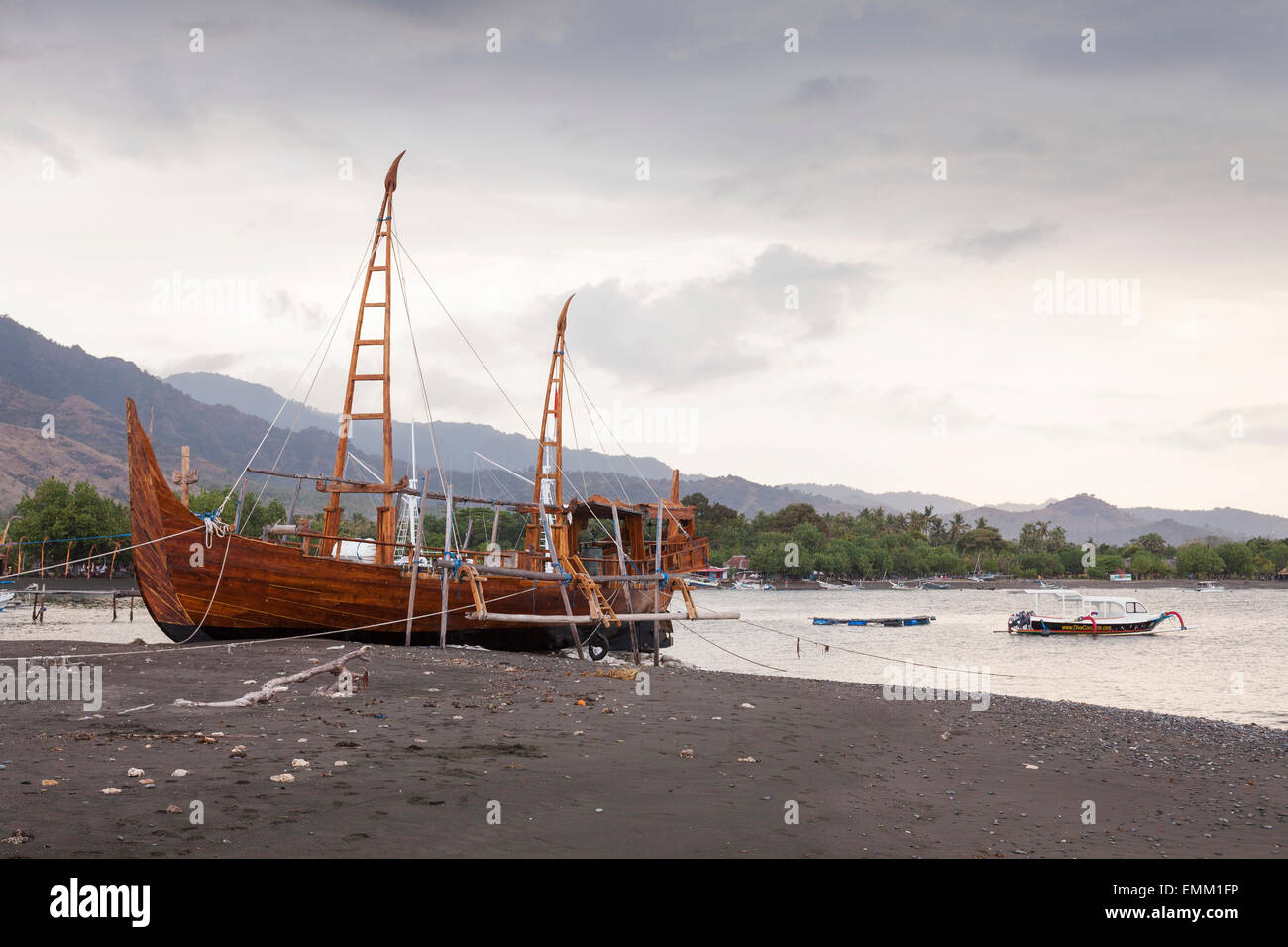 Replica merchant ship, traditional wooden boat on beach, Pemuteran ...