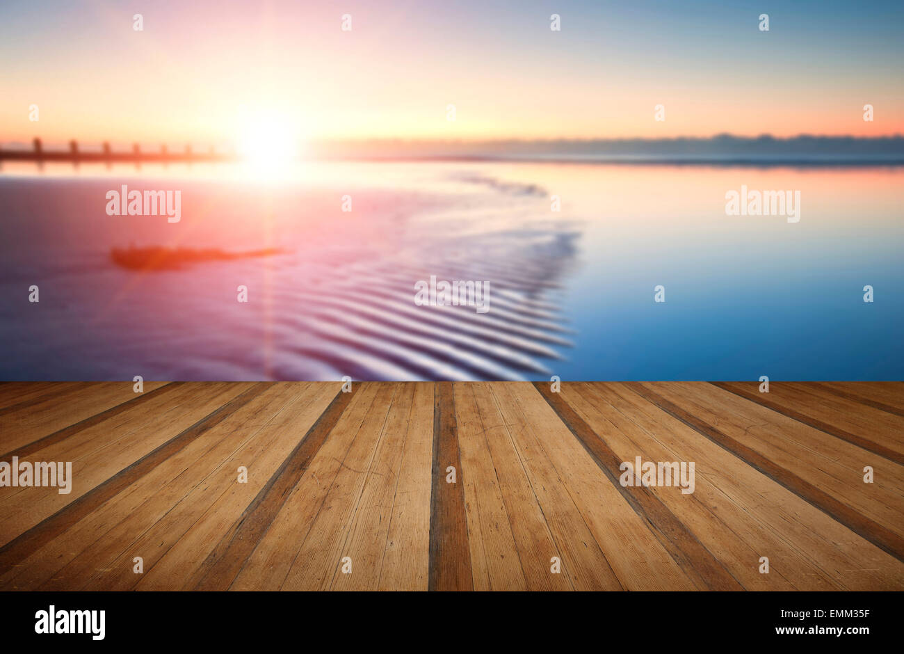 Beautiful low point of view along beach at low tide out to sea with ...