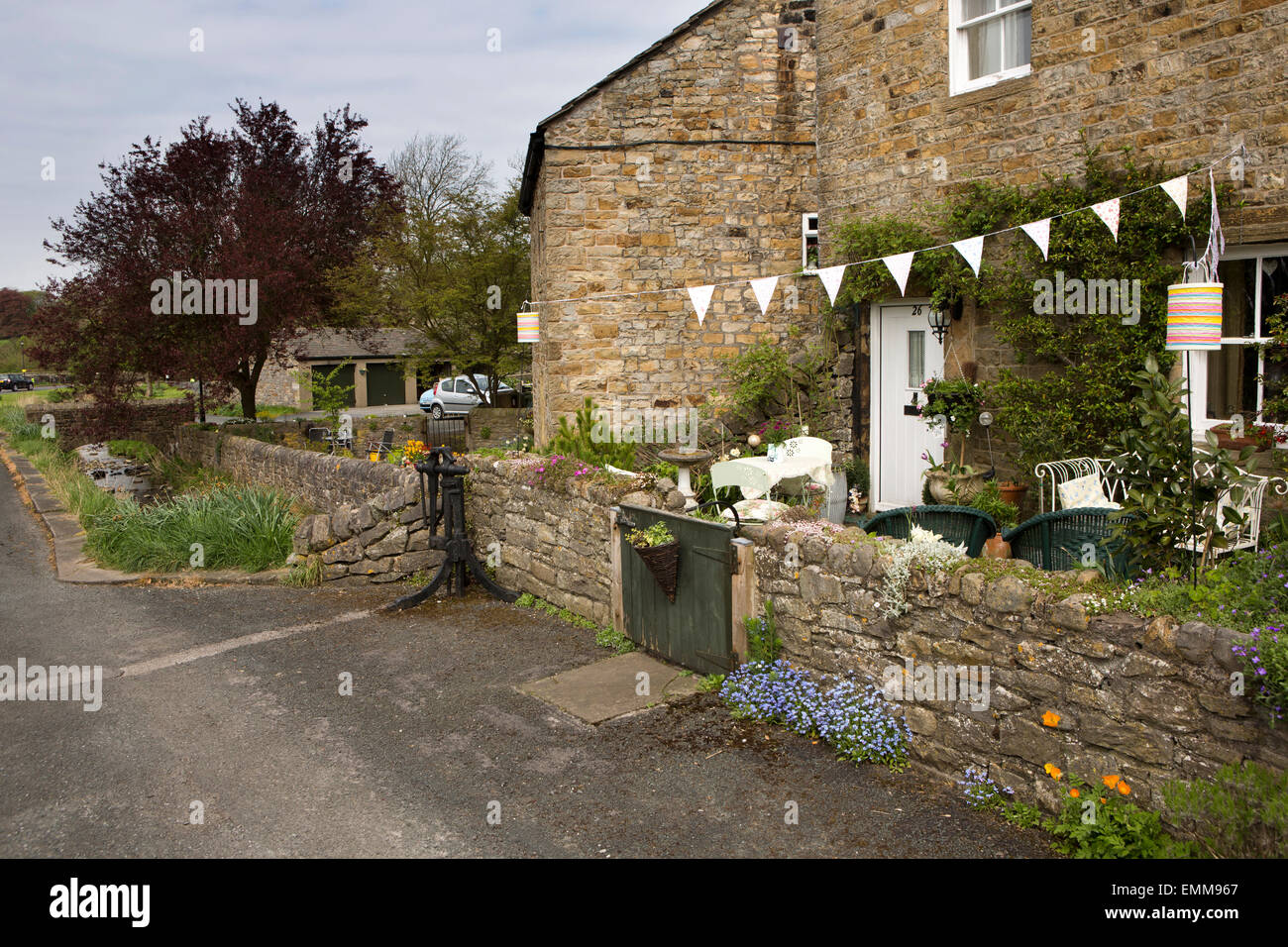 UK, England, Lancashire, Ribble Valley, Downham, cottage garden over ...