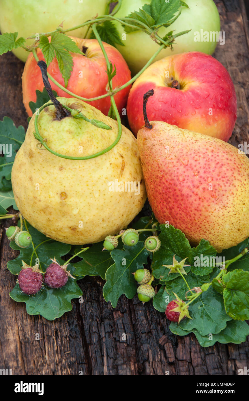 Ripe pear and berry raspberry on wood countertop Stock Photo - Alamy