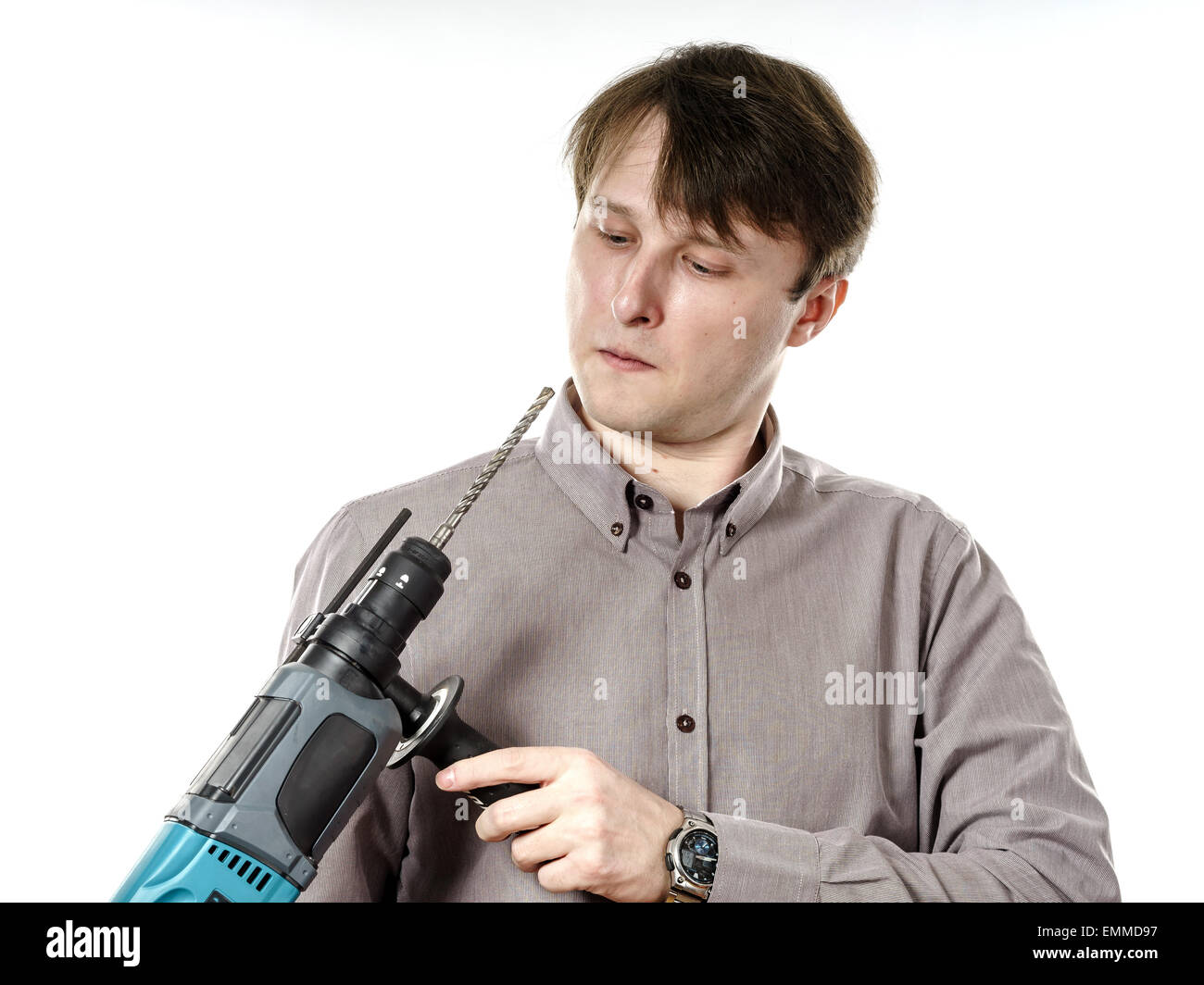 Young man with drilling machine in his hands ready to professional ...