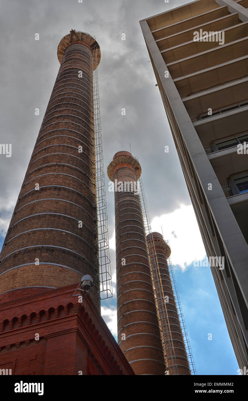 View of old smokestack in urban panorama Stock Photo - Alamy