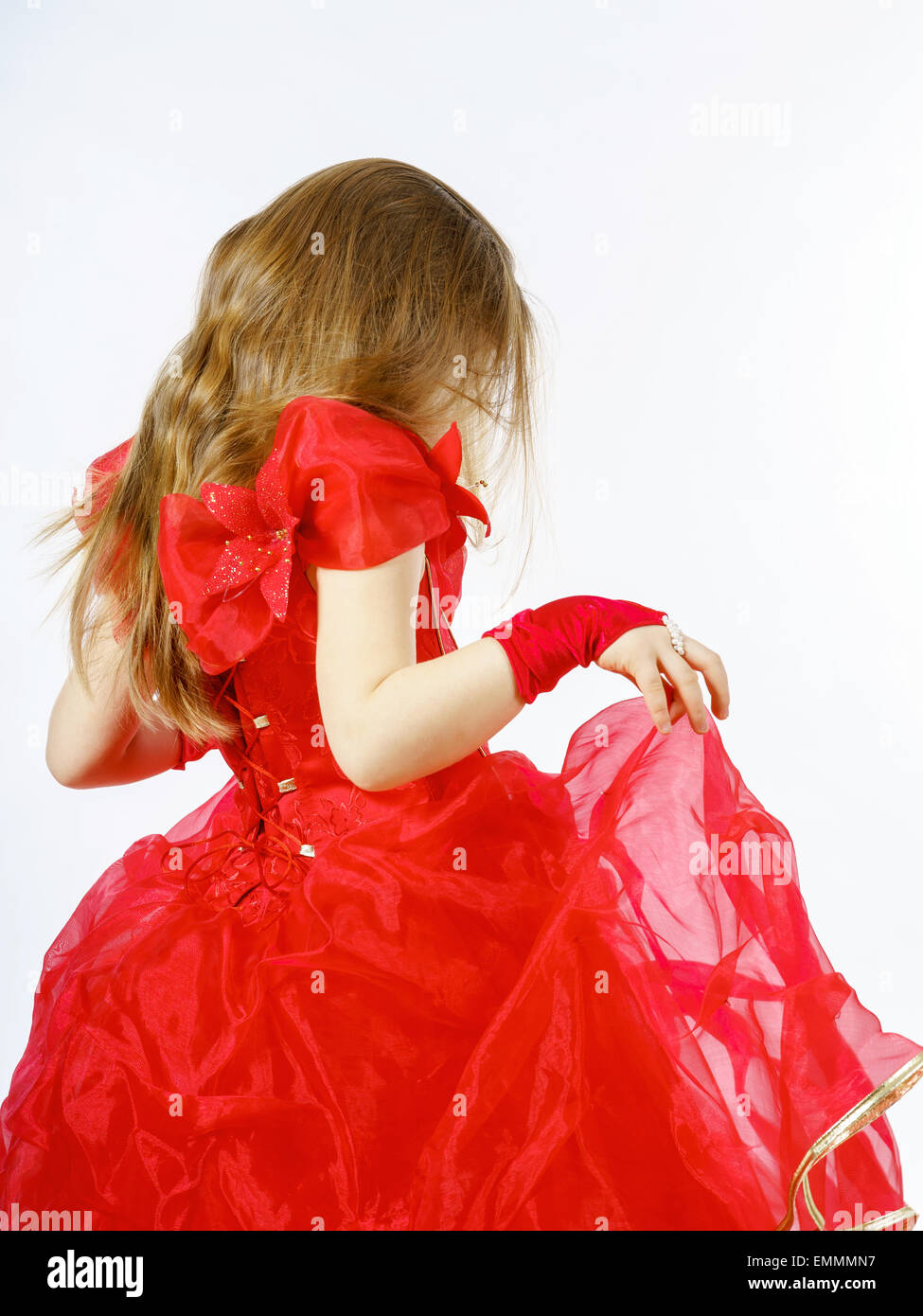 Cute little princess dressed in red dancing. Isolated on white ...