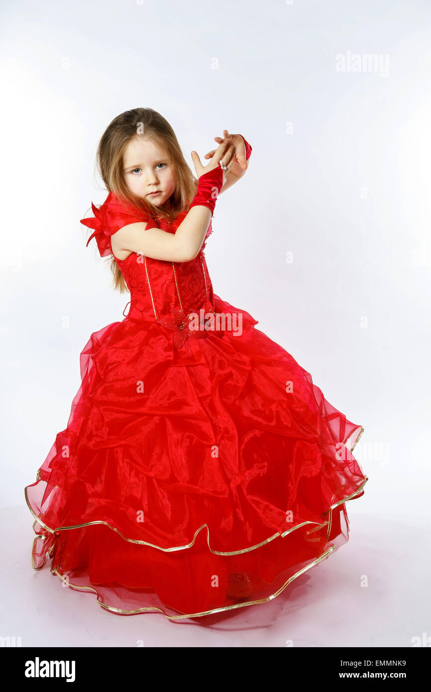 Cute little princess dressed in red dancing. Isolated on white ...