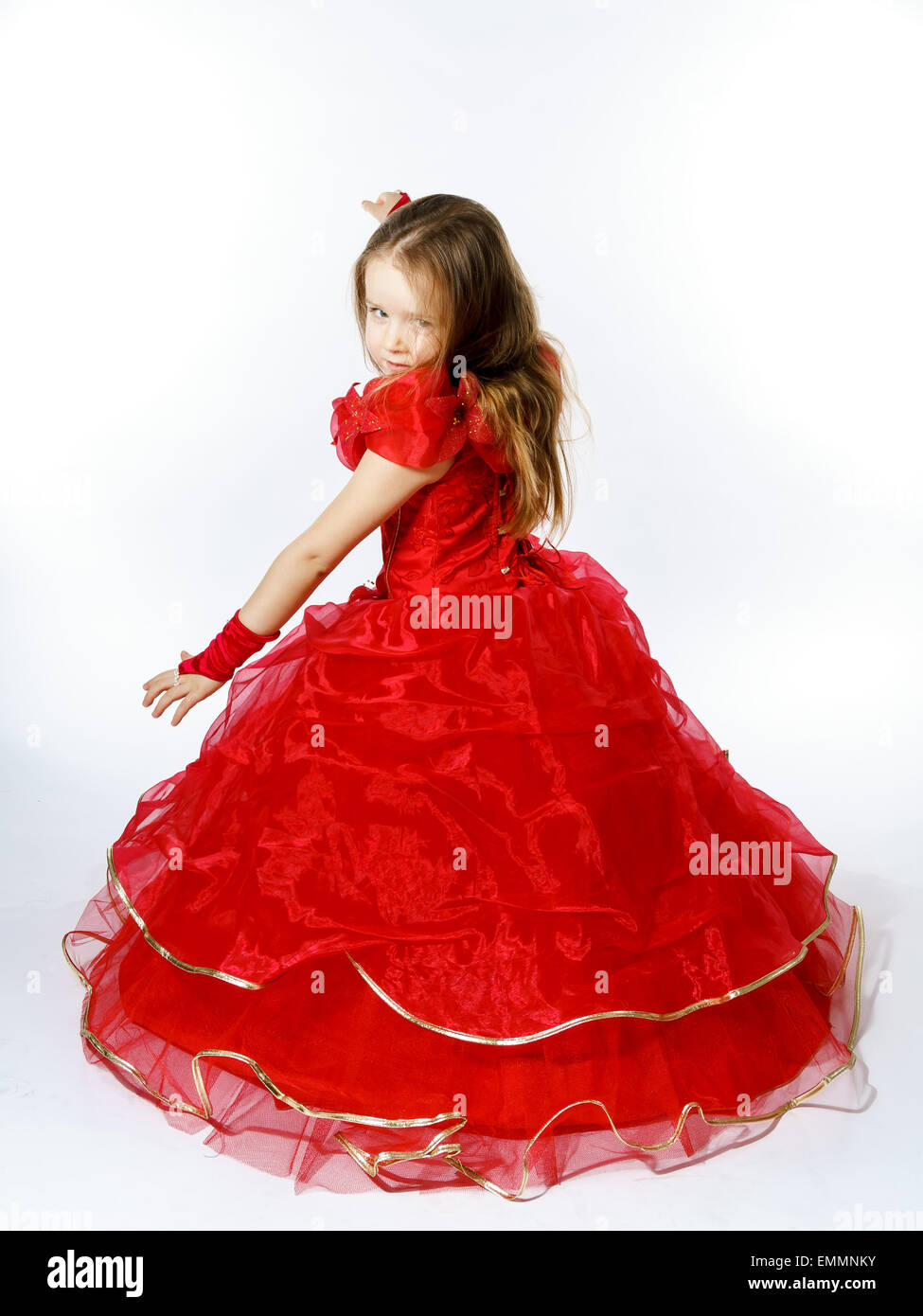 Cute little princess dressed in red dancing. Isolated on white ...